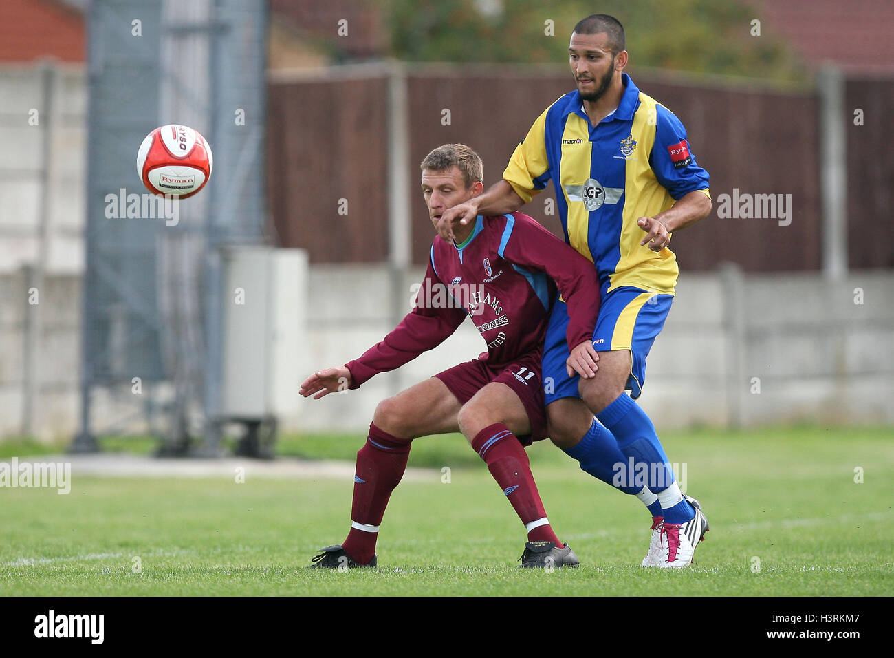 Stuart Strange of Crawley Green shields the ball from Mohammed Ali ...