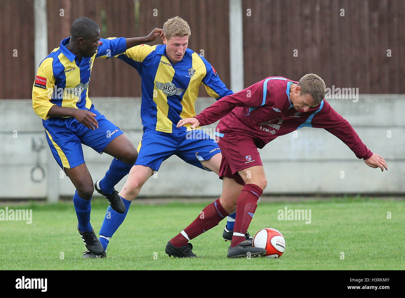 Stuart Strange (R) of Crawley Green evades Abaymoi Seymour (L) and Andy ...