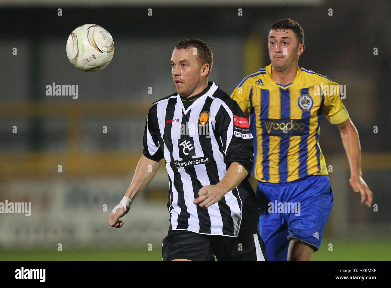 Stuart Thurgood of East Thurrock shields the ball from Jamie Dicks of ...