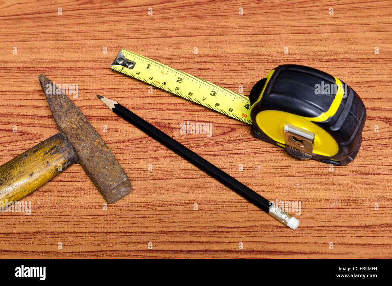 hammer measuring tape and pencil Stock Photo - Alamy
