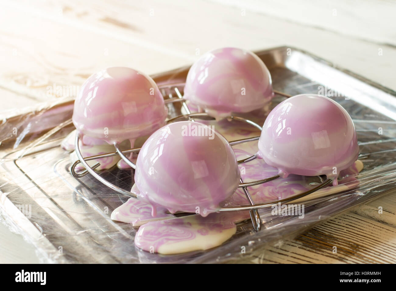 Desserts with liquid icing Stock Photo - Alamy