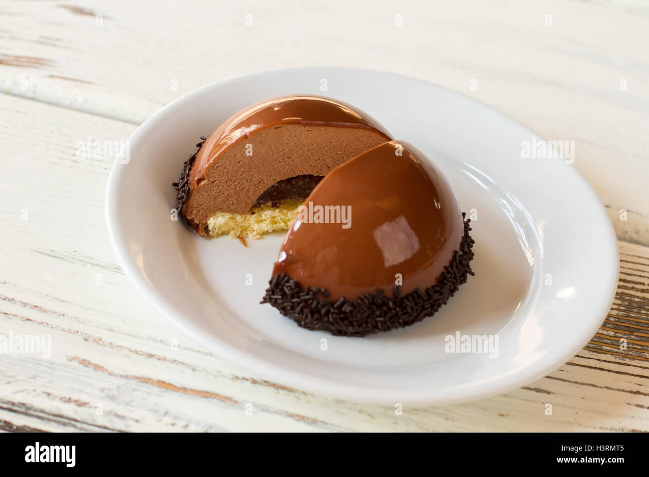 Brown dessert cut in half Stock Photo - Alamy