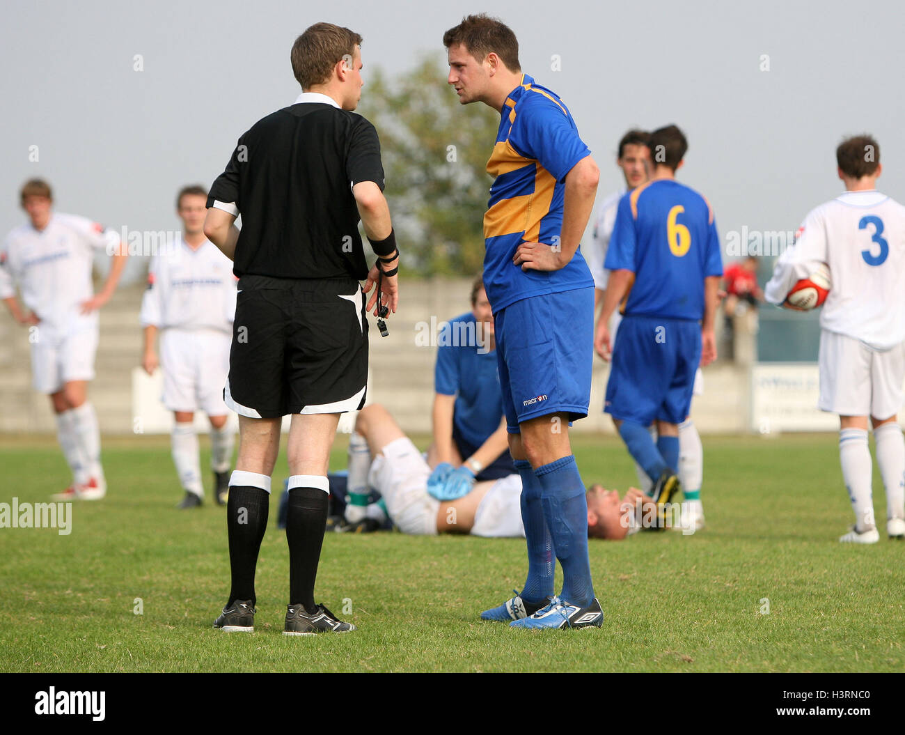 Bobby Port of Romford collides with Matt Nolan of Lowestoft and is ...