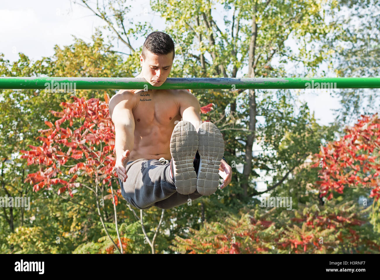 Extreme Sports. Iron Neck Hold. Young Athlete Working Out in an Outdoor ...