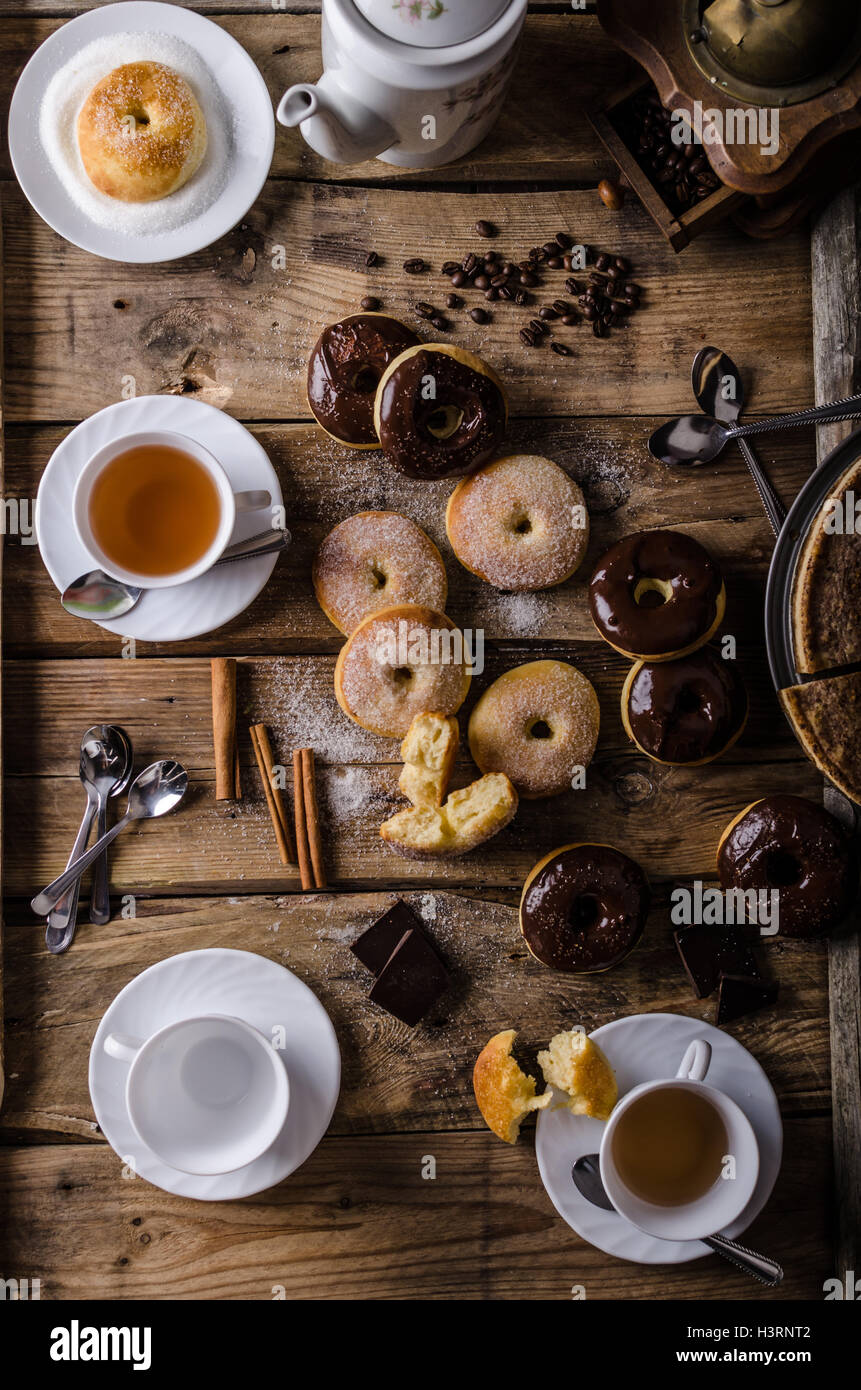Old style donuts with sugar and dark chocolate, whole table, place for ...