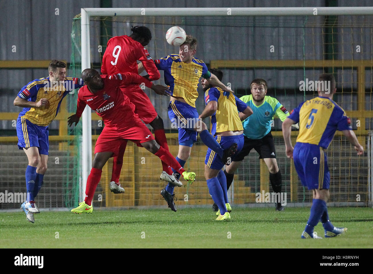 Jack Barry of Romford heads clear from Brian Moses - Romford vs ...