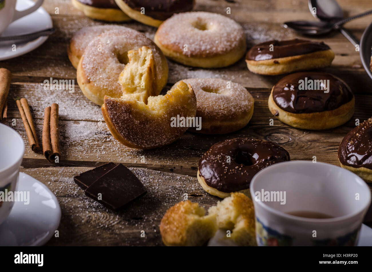 Old style donuts with sugar and dark chocolate, whole table, place for ...
