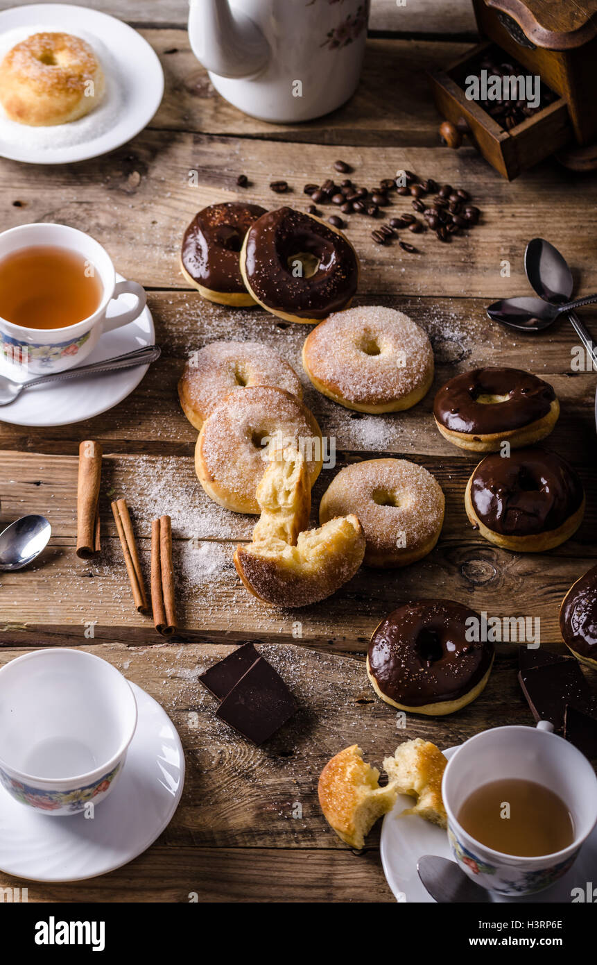 Old style donuts with sugar and dark chocolate, whole table, place for ...
