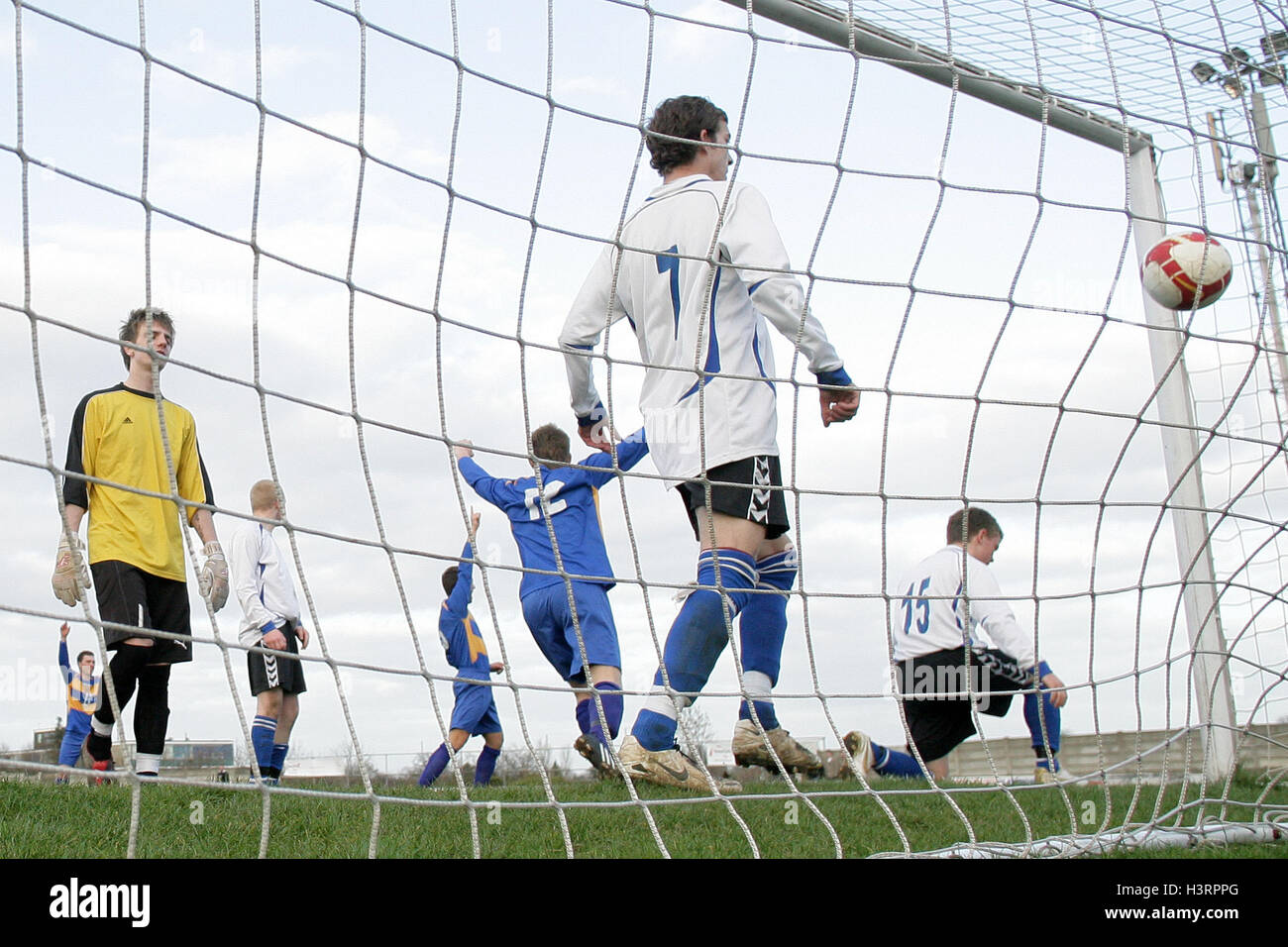 Football action arm raised hi-res stock photography and images - Alamy