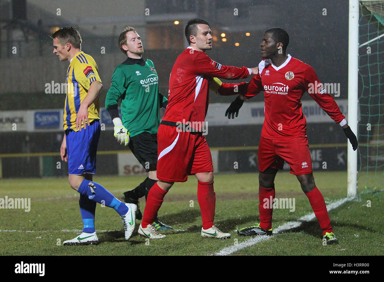Joe Nightingill of Tilbury (C) tries to separate Ben Jones of Romford ...