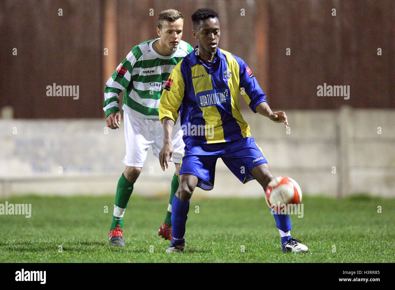 Ade Cole of Romford shields the ball from Louis Bristow - Romford vs ...