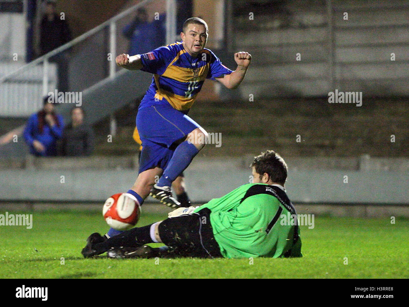 Toran Senghore of Romford shoots past Ware goalkeeper Harry Ricketts ...