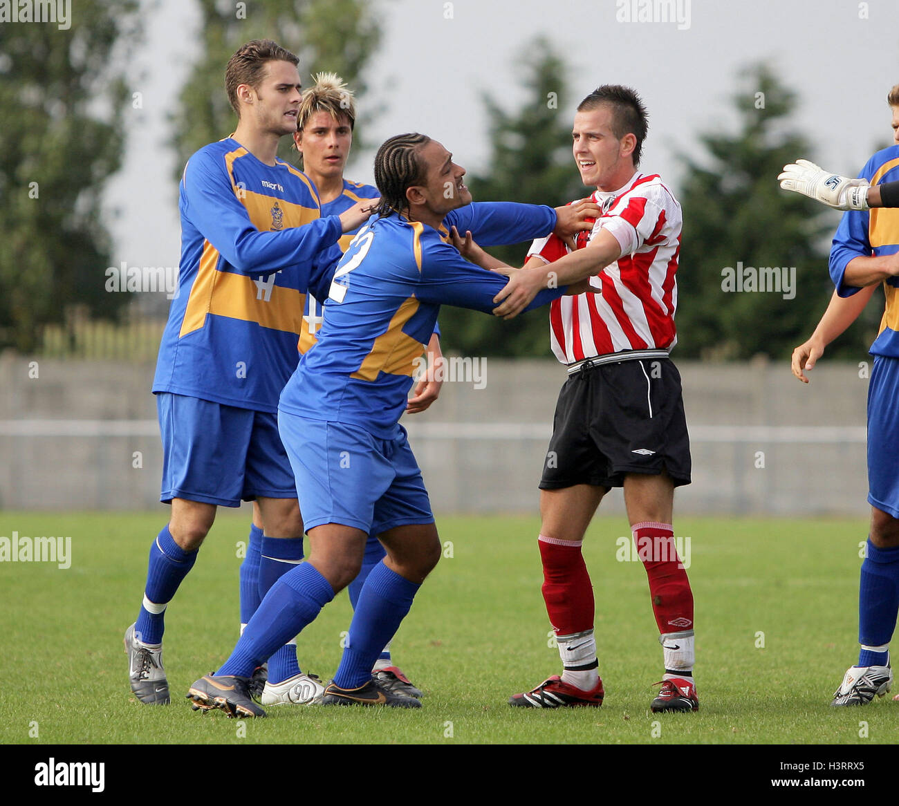 Danny Downer (3rd left) is the centre of attention as a second-half ...