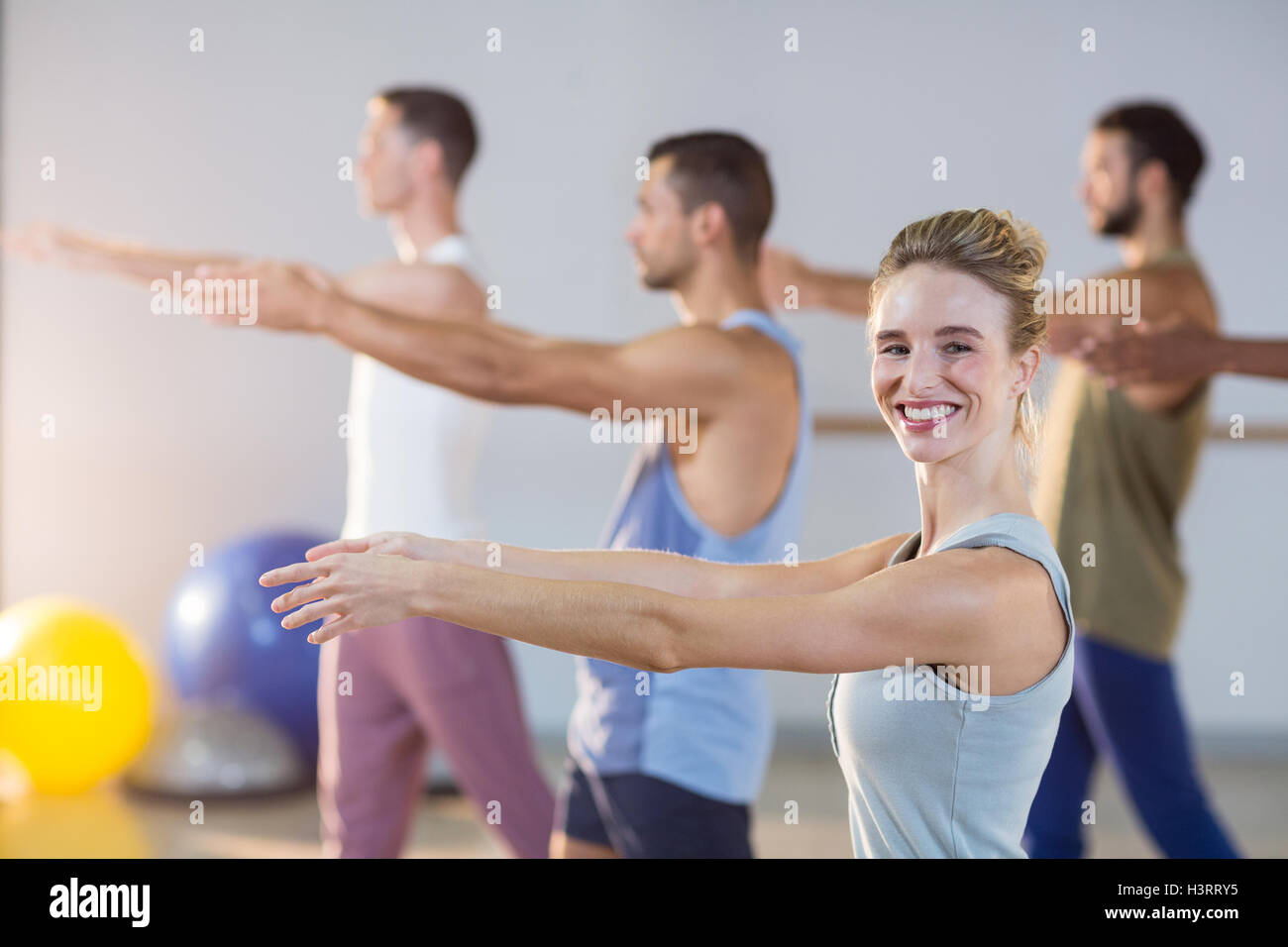 Group of people performing exercise Stock Photo - Alamy