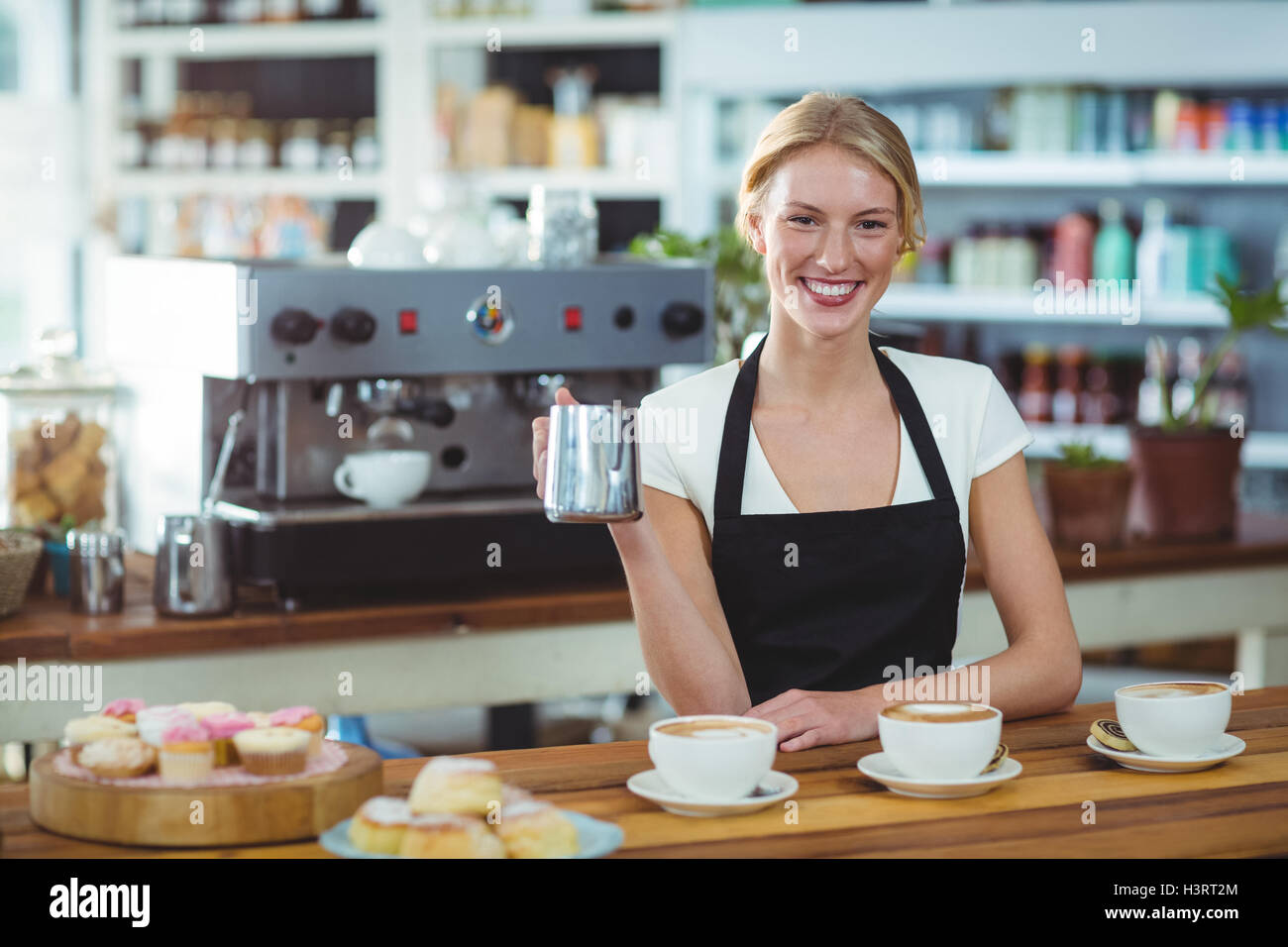 Portrait of waitress making cup of coffee at counter Stock Photo - Alamy