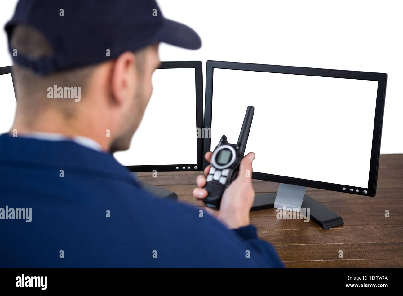 Security man looking at monitors hi-res stock photography and images ...