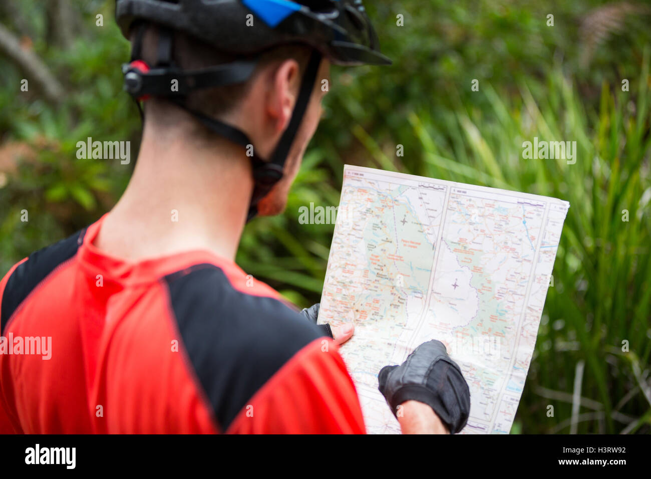 Cyclist holding map hi-res stock photography and images - Alamy