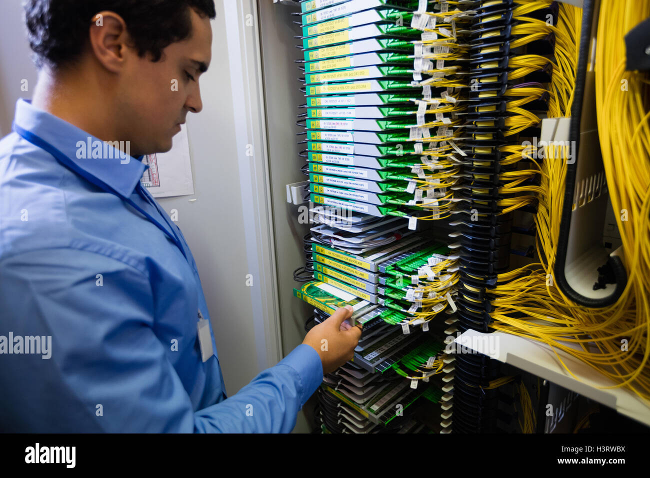 Technician checking routers Stock Photo - Alamy