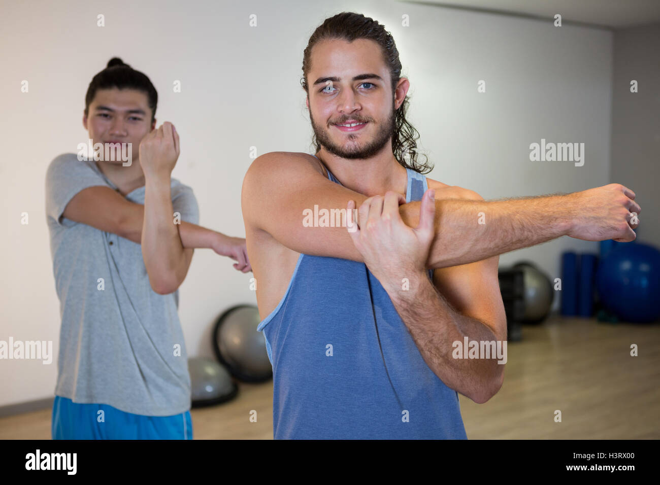 Smiling two men doing aerobic exercise Stock Photo - Alamy