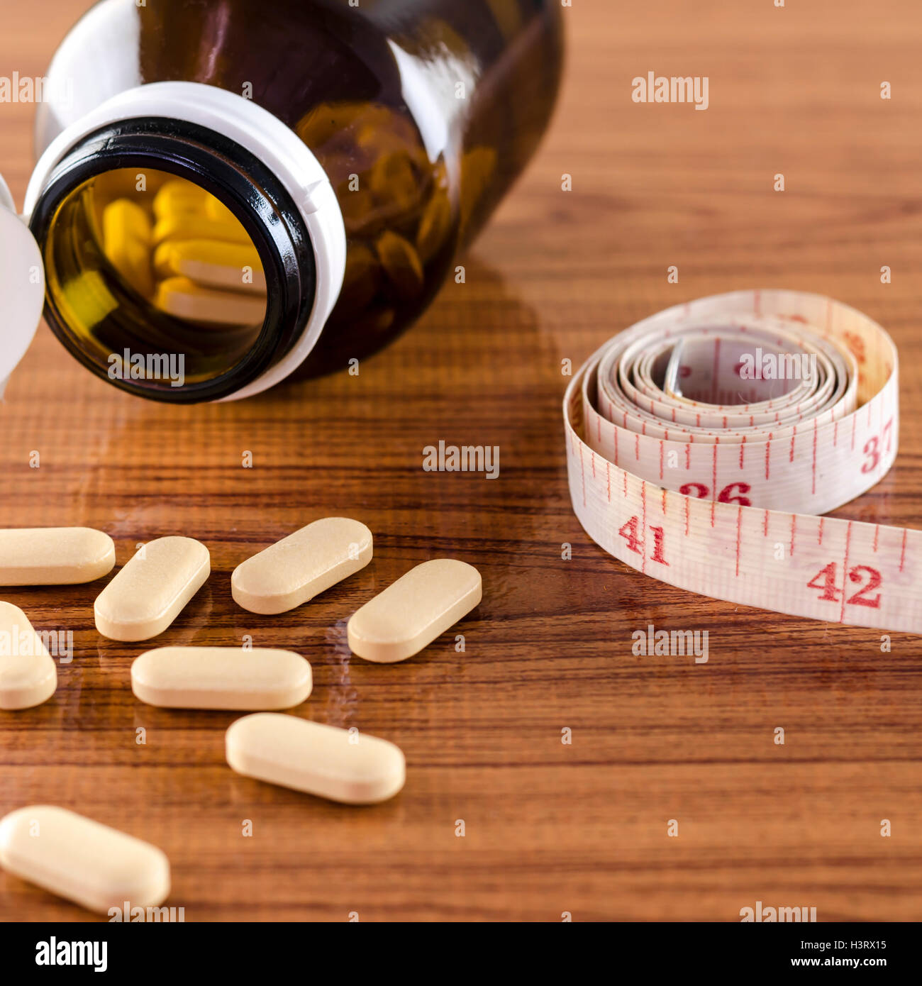 pills and measuring tape Stock Photo - Alamy