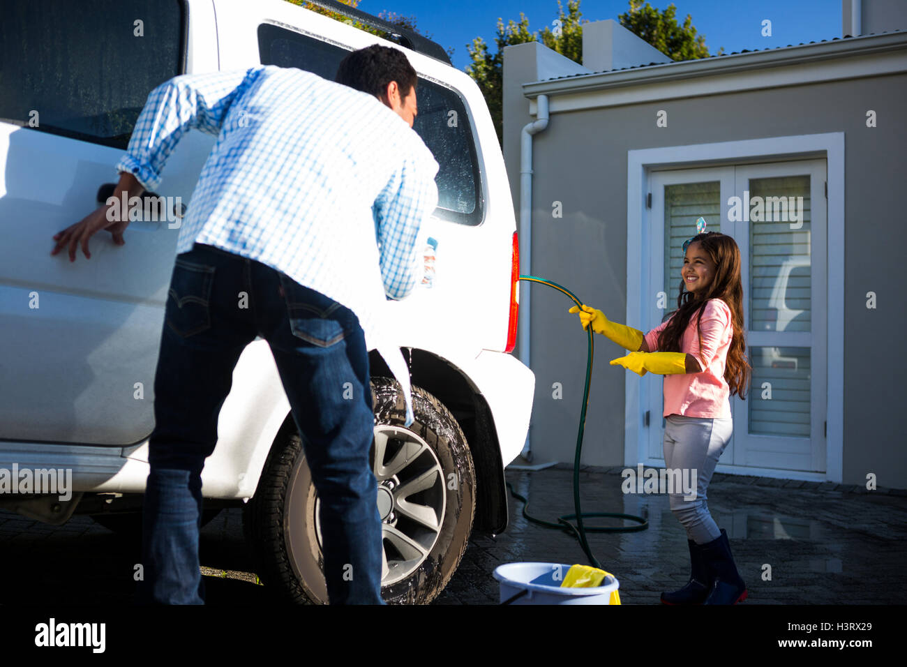 Father and daughter washing car together Stock Photo - Alamy
