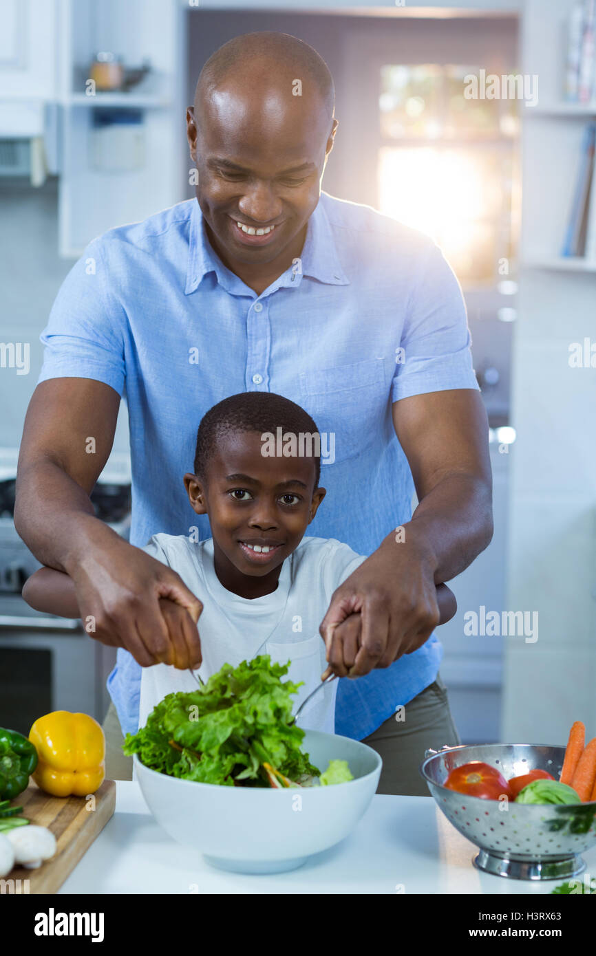 Father and son preparing food Stock Photo - Alamy