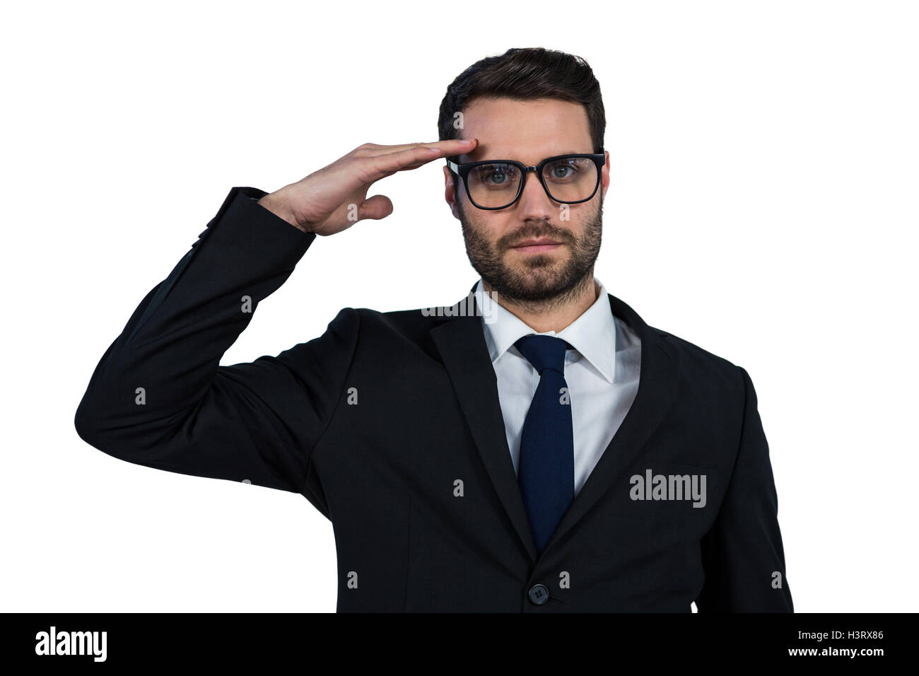 Businessman saluting against white background Stock Photo - Alamy