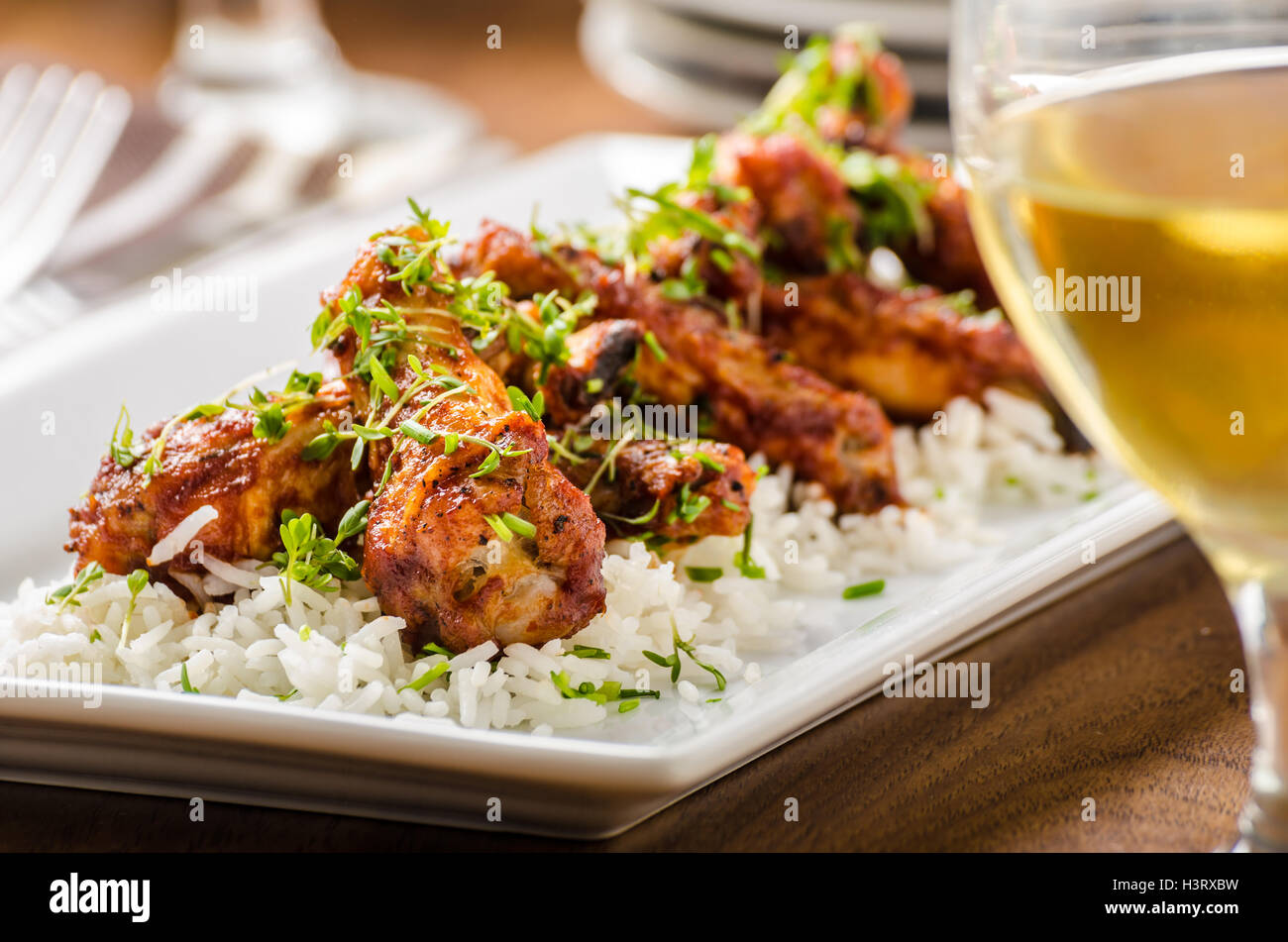 Grilled chicken wings Hot wings with basmati rice, topped with ...