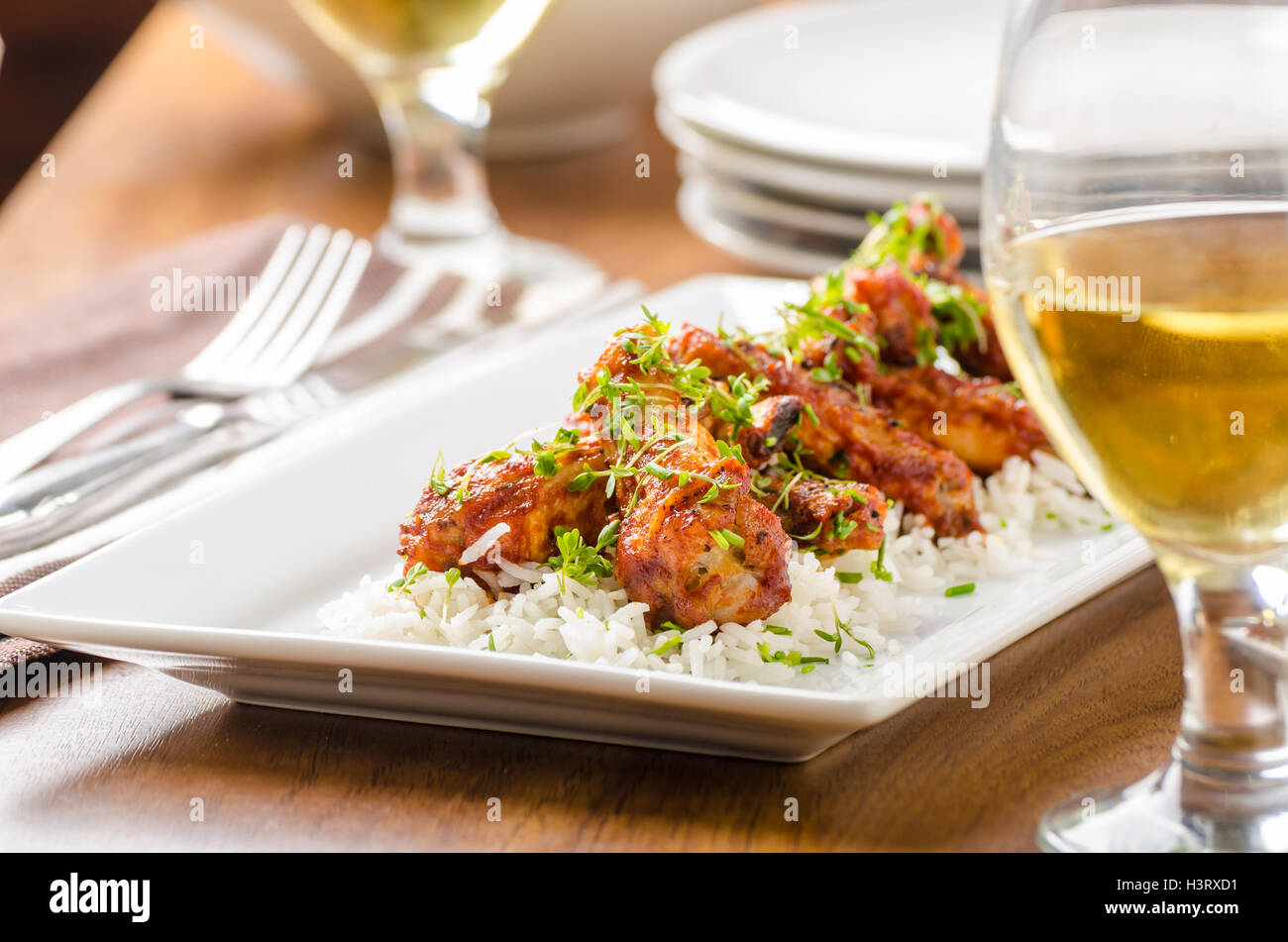 Grilled chicken wings Hot wings with basmati rice, topped with ...