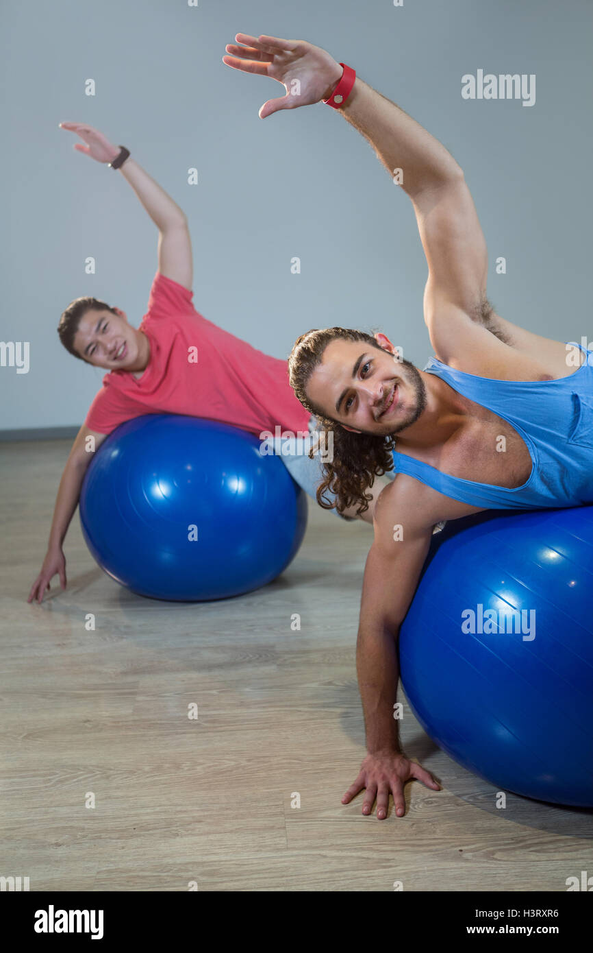 Men exercising with exercise ball Stock Photo - Alamy