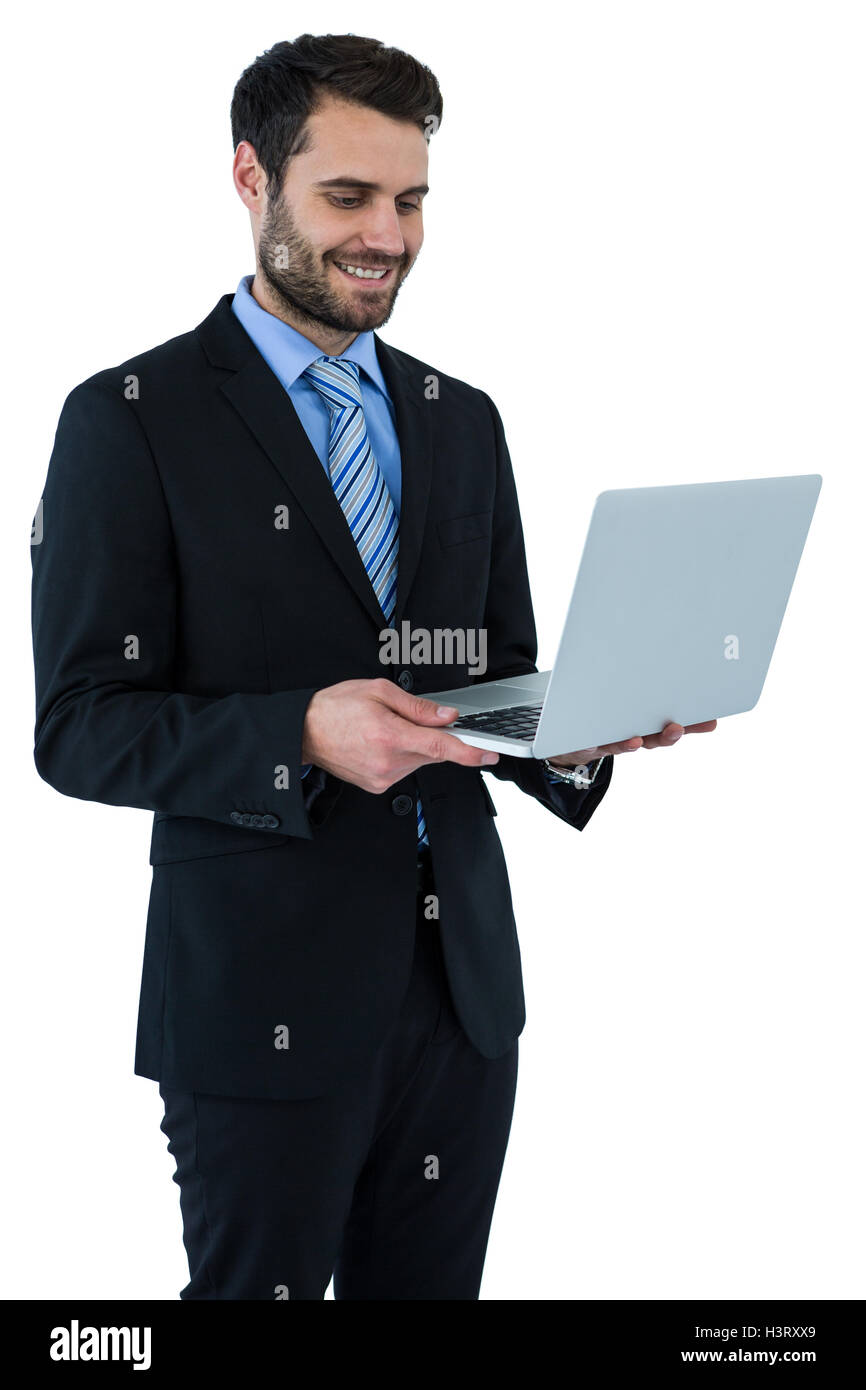 Businessman holding laptop Stock Photo - Alamy