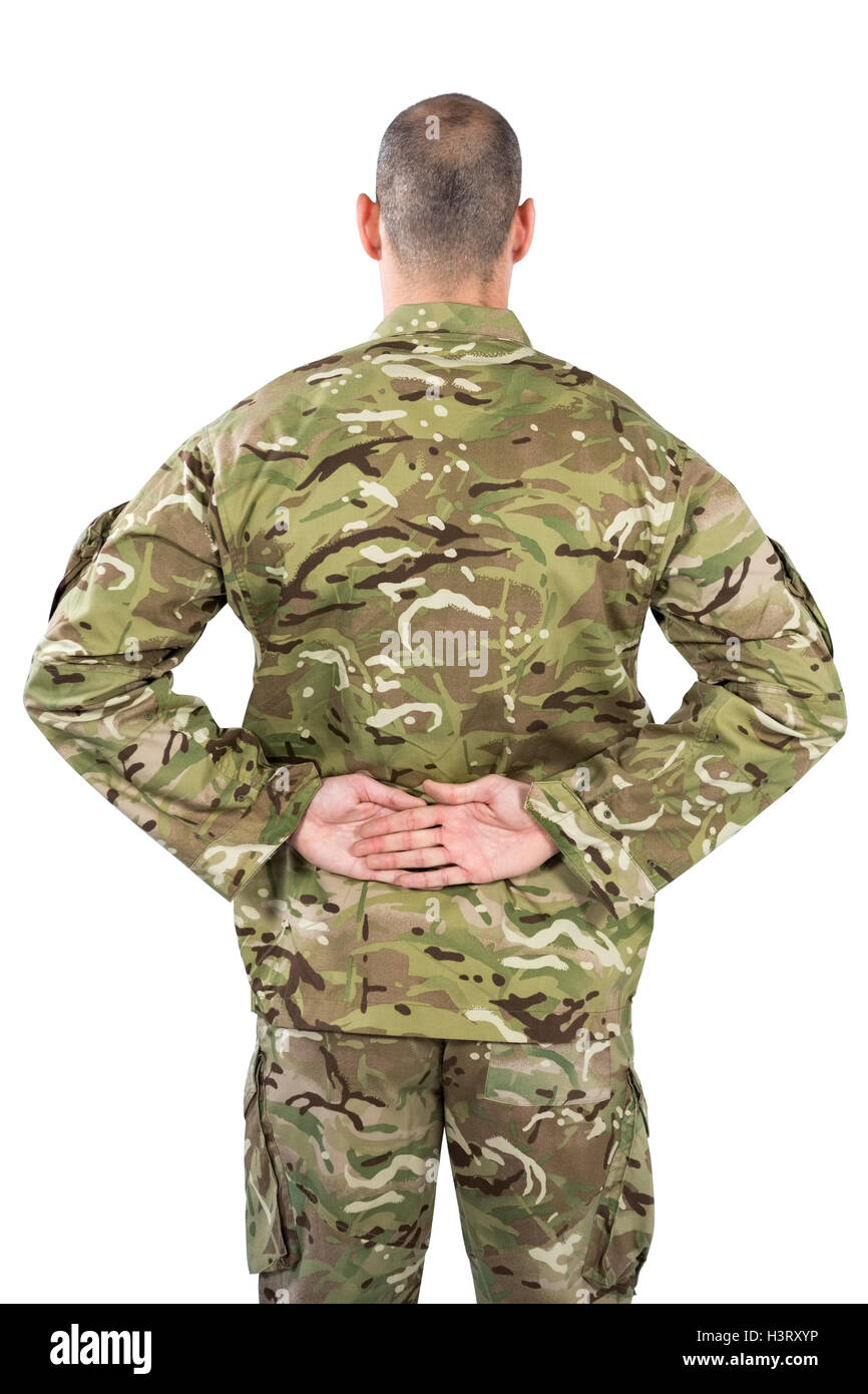 Rear view od soldier standing with his hands behind back Stock Photo ...