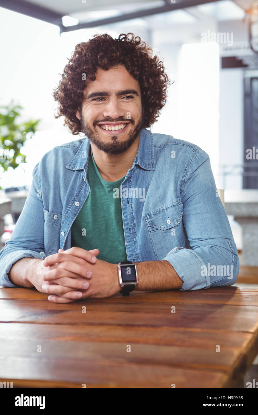 Man sitting and smiling Stock Photo - Alamy