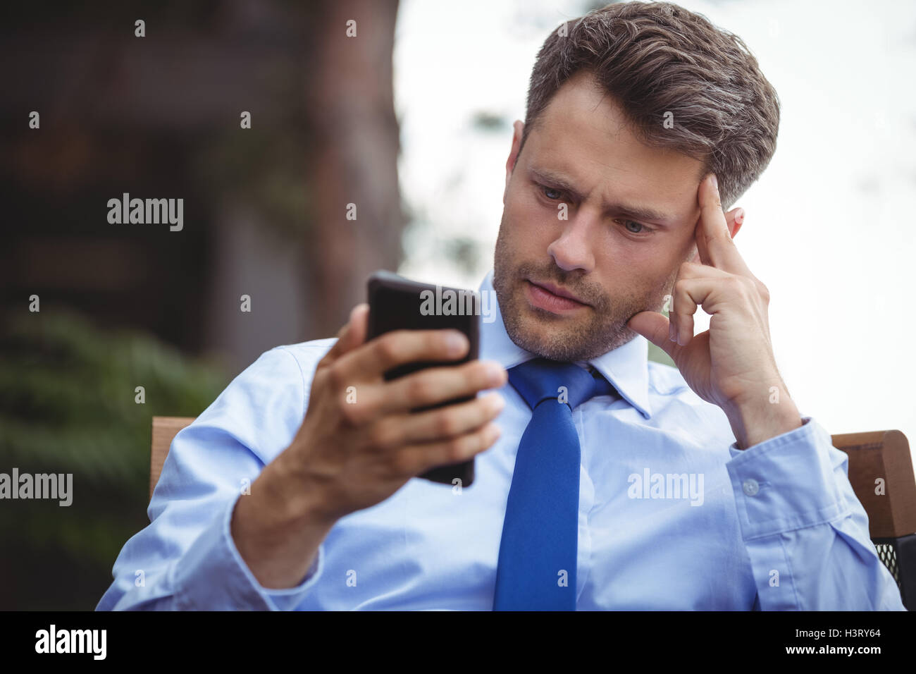 Businessman using mobile phone Stock Photo - Alamy