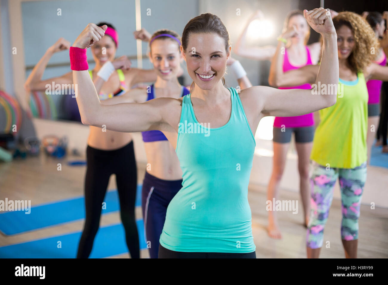 Women muscle strength showing biceps hi-res stock photography and ...