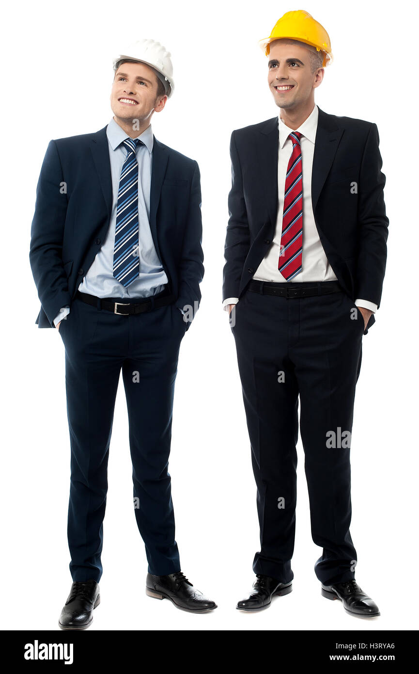 Young engineers wearing safety helmet Stock Photo - Alamy