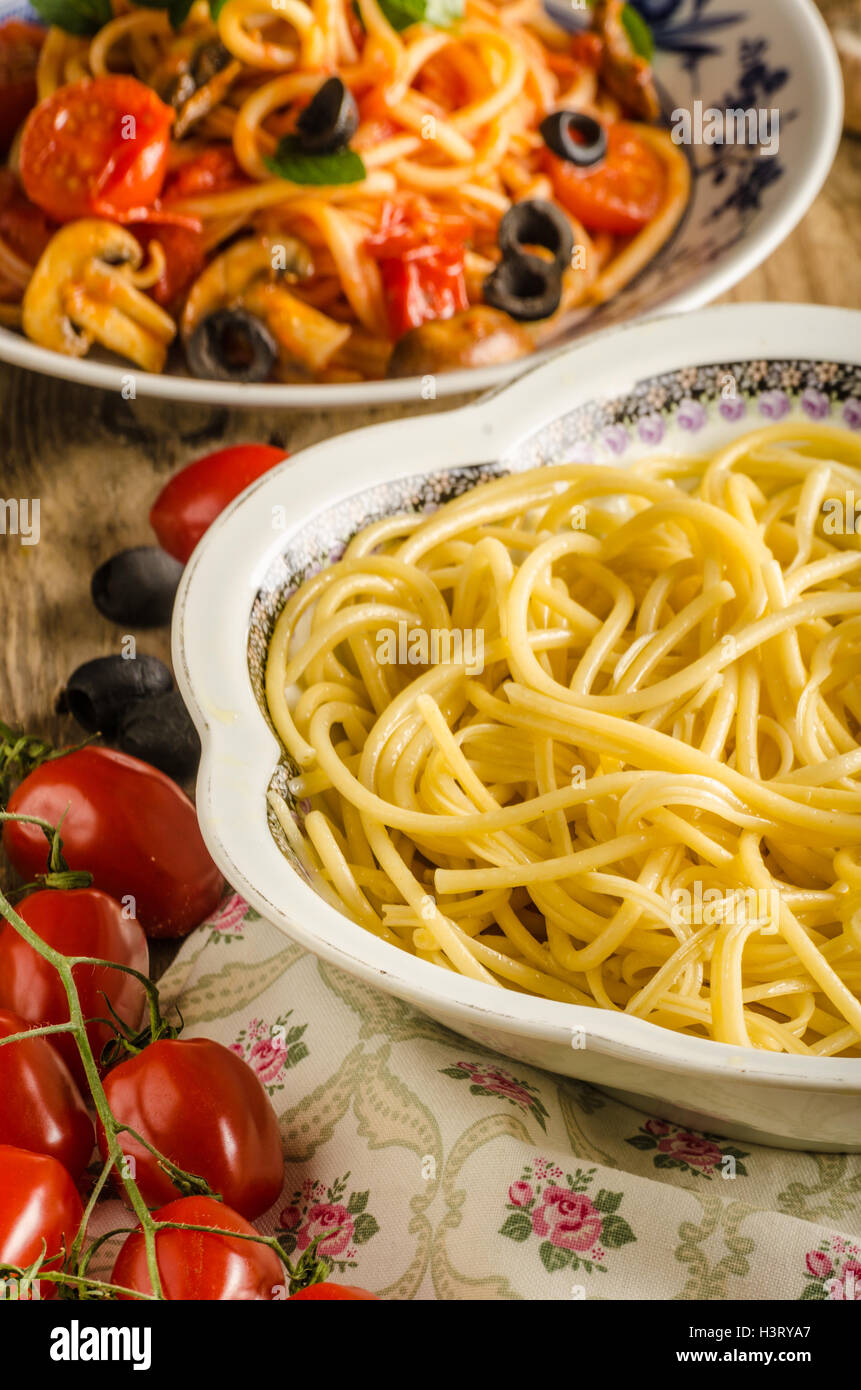 Pasta with olives, tomatoes and basil, fresh pasta, orange juice Stock ...