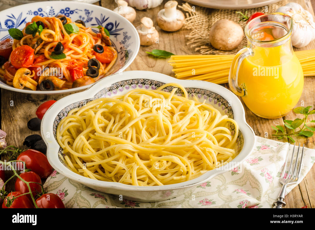 Pasta with olives, tomatoes and basil, fresh pasta, orange juice Stock ...