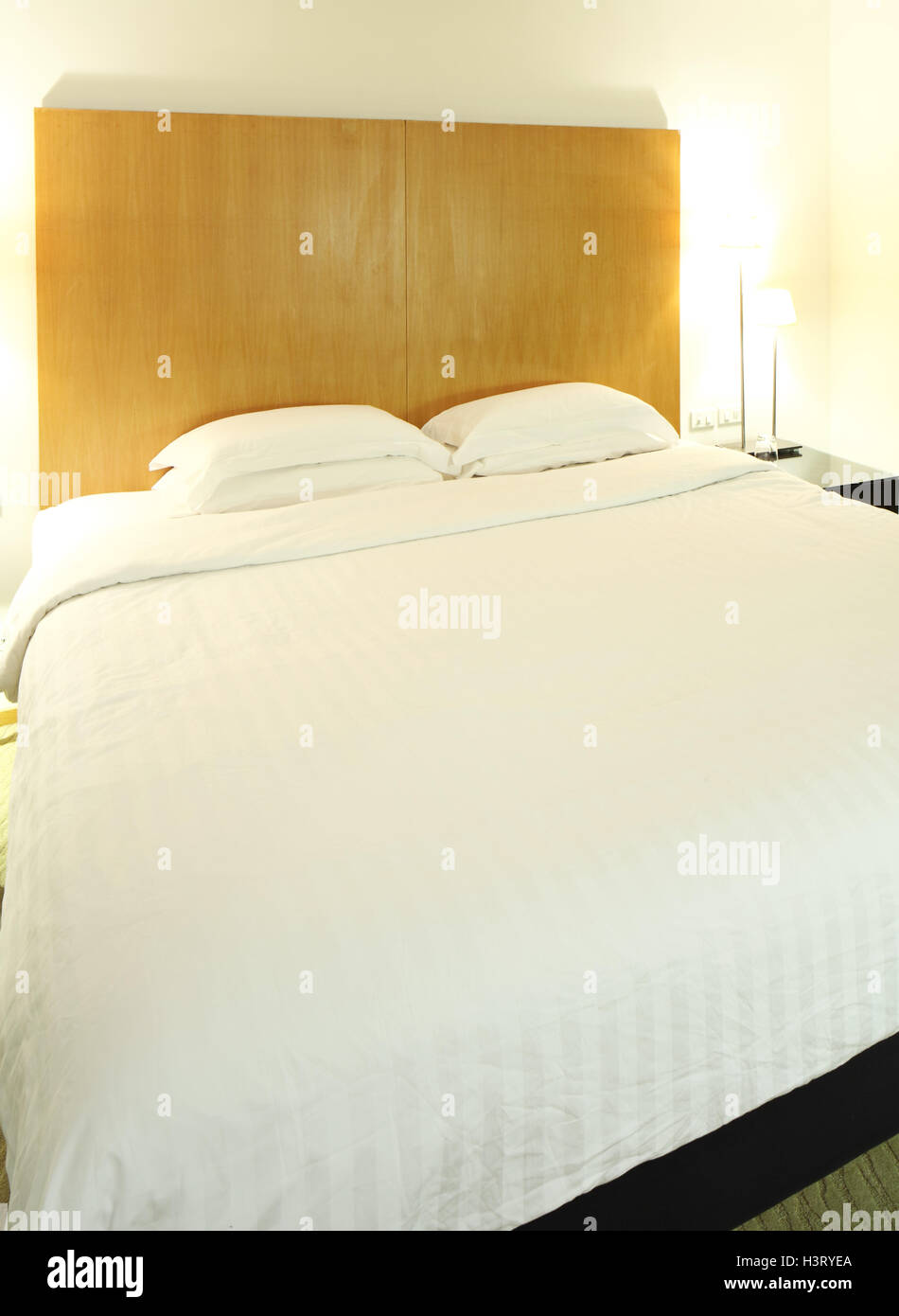 Bed in room Stock Photo - Alamy
