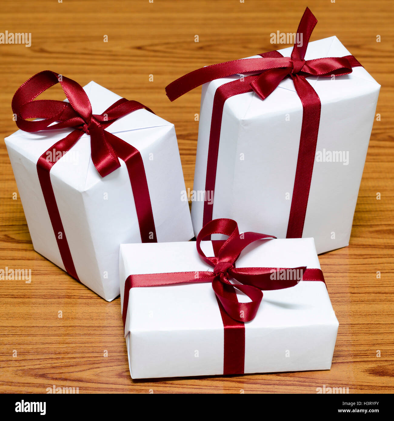 white gift box with red ribbin Stock Photo - Alamy