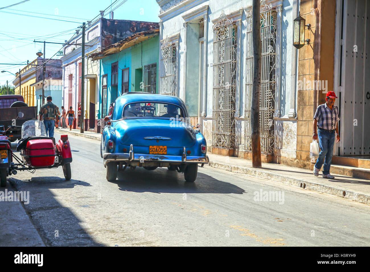 Classic Chevrolet driving on the street in Trinidad Stock Photo - Alamy