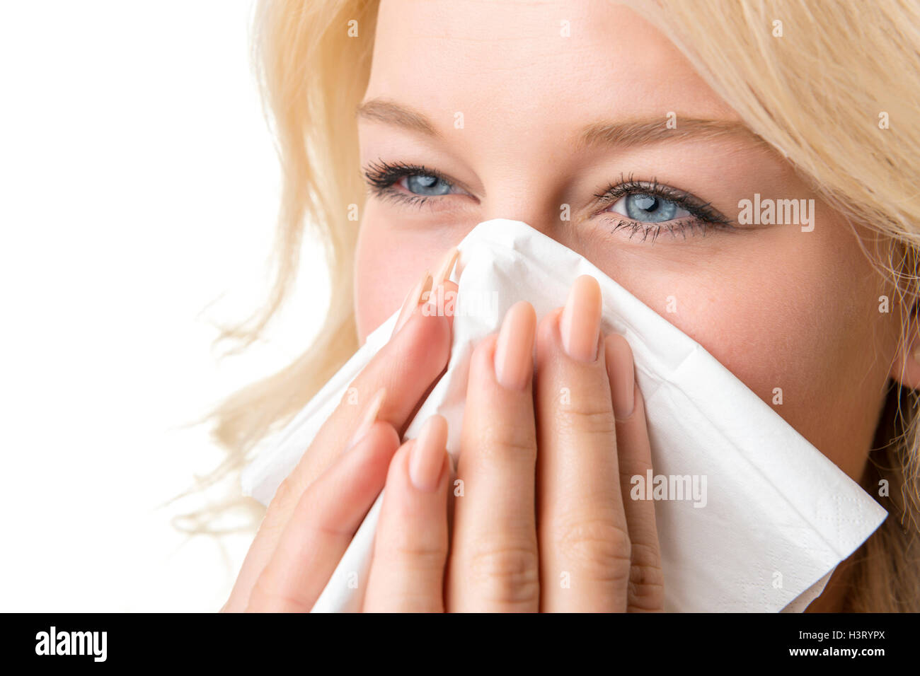 Ill woman with tissue is sneezing Stock Photo - Alamy