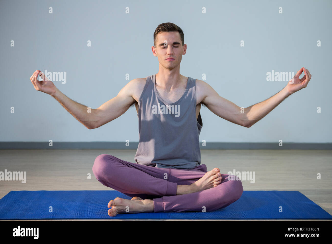 Man performing yoga Stock Photo - Alamy