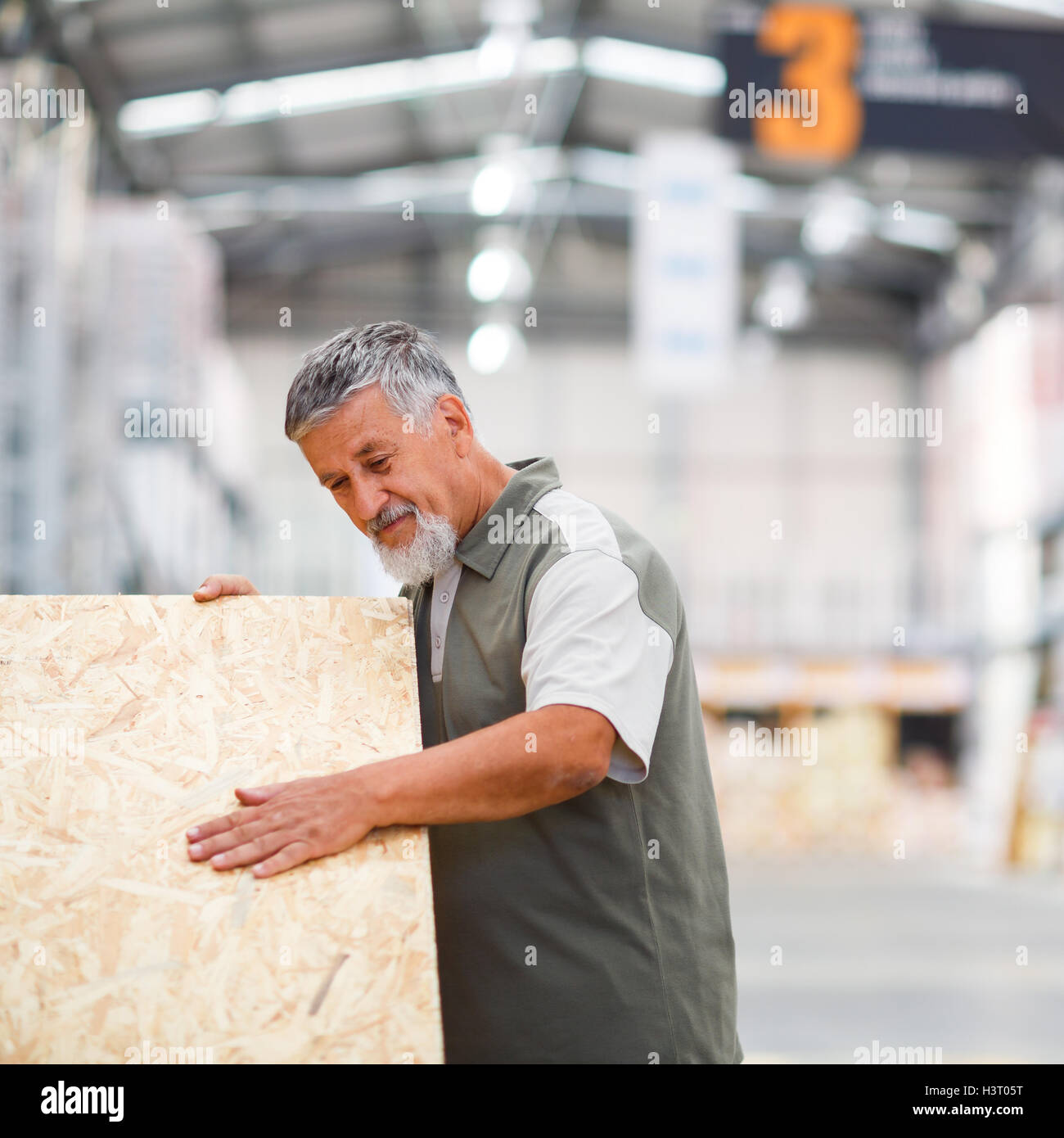Man buying construction wood in a DIY store Stock Photo - Alamy
