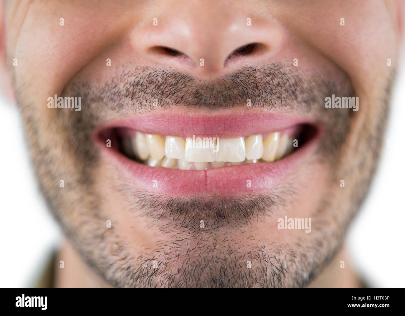 Man showing his teeth Stock Photo - Alamy