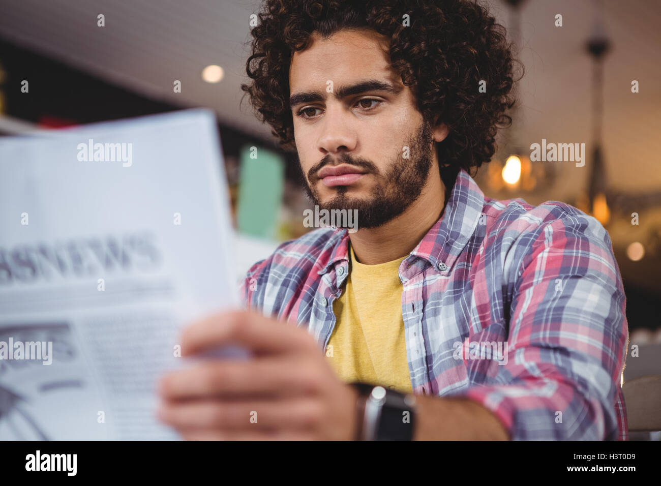 Man reading newspaper Stock Photo - Alamy