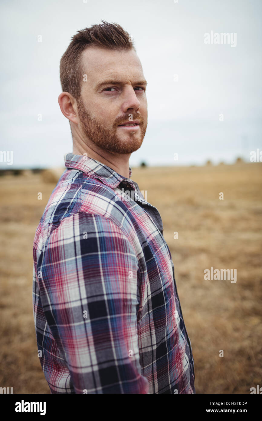 Portrait of farmer standing in the field Stock Photo - Alamy