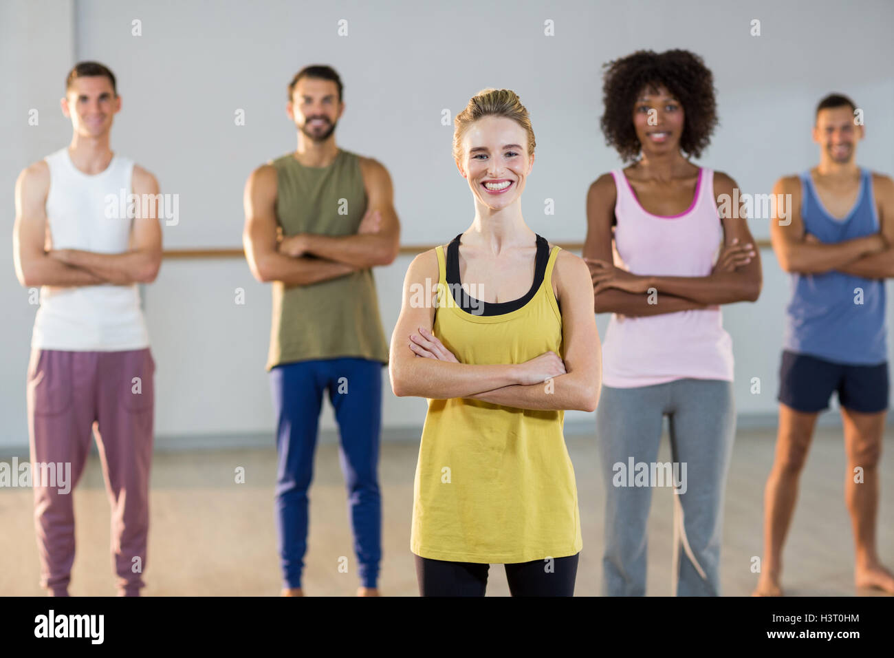 Portrait of group of people standing in gym Stock Photo - Alamy