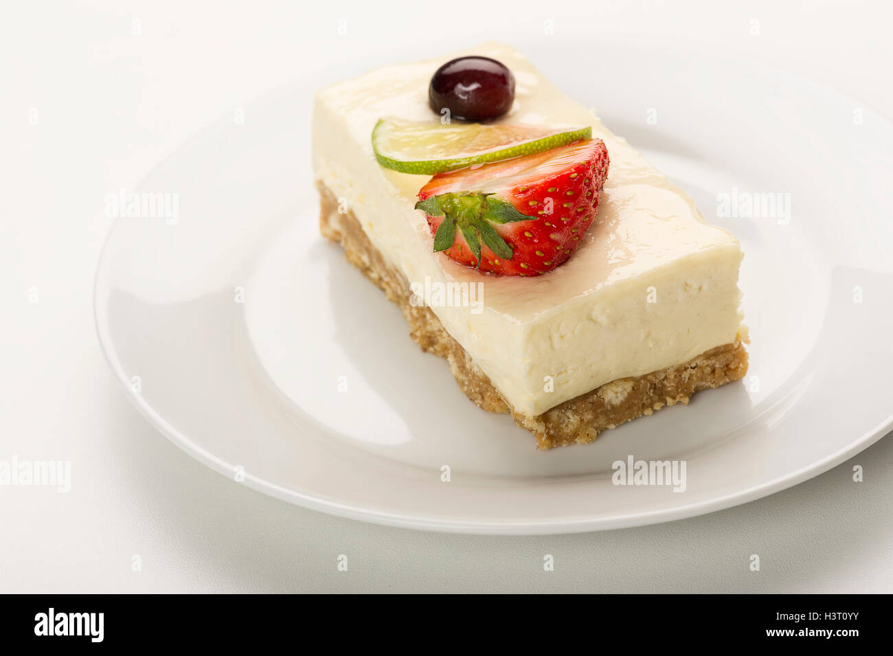 Slice of delicious tangy lemon cheesecake Stock Photo - Alamy