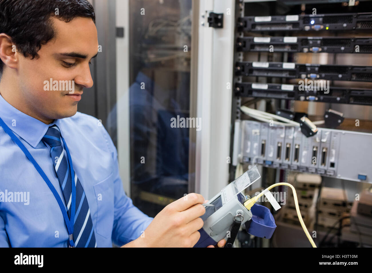 Technician using digital cable analyzer Stock Photo - Alamy